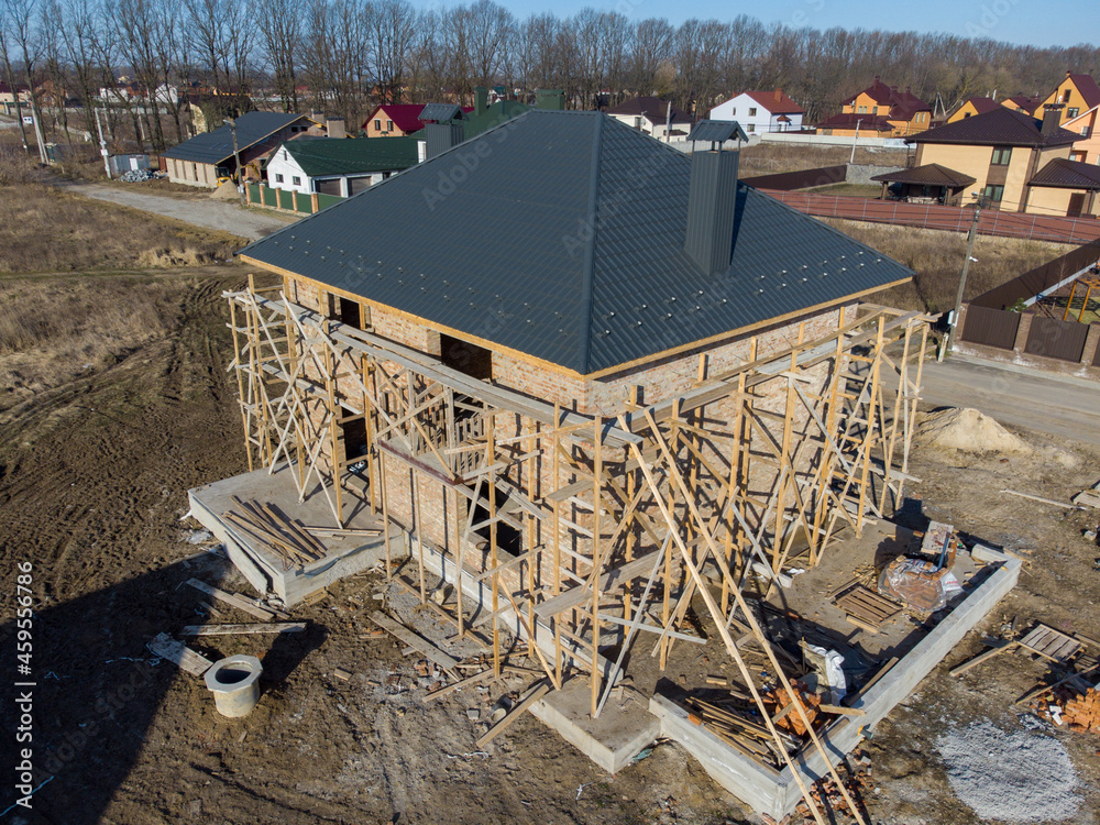 Newly built homes in a residential estate. Construction of the building ...