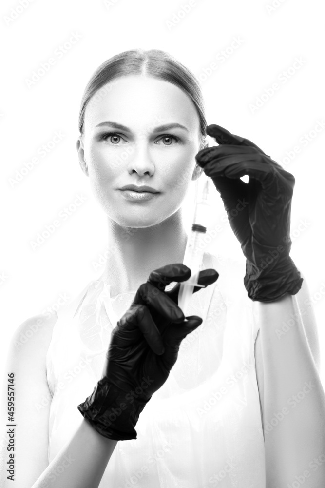 Doctor. Close-up beauty fashion model woman face, holding syringe ...
