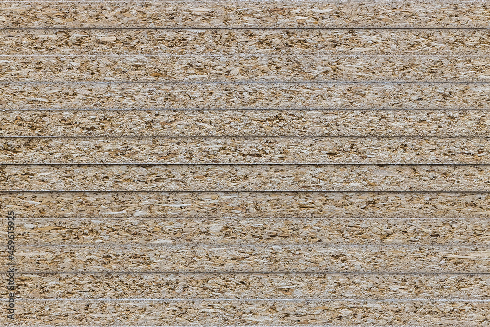 The texture of a stack of OSB sheets in a supermarket. Side view ...