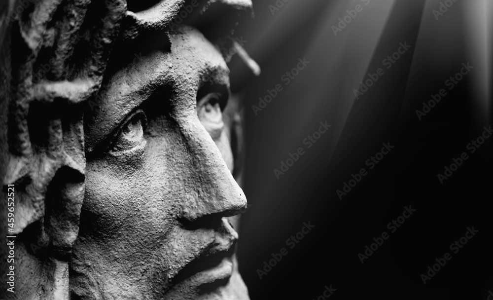 Jesus Christ against dark background. Ancient statue. Horizontal image ...