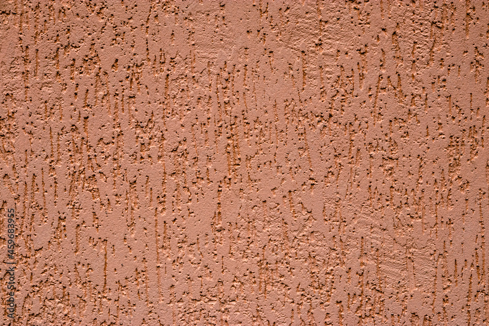 Simple textured finish of facade of building. In form of uneven ...