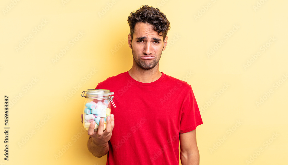 Foto de hispanic handsome man feeling sad and whiney with an unhappy ...