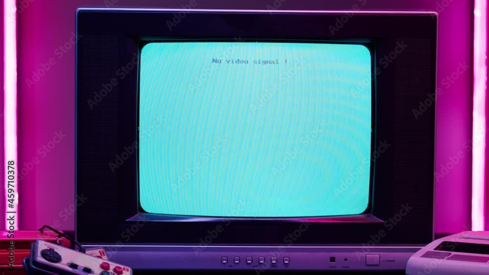 Old television with blue screen on pink neon background. Close-up of ...