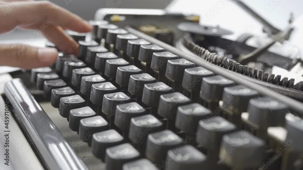 People hands typing an old Thai traditional typewriter. Classic vintage ...