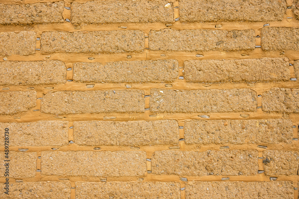 Detail of old adobe brick wall for background or texture. Mud brick ...