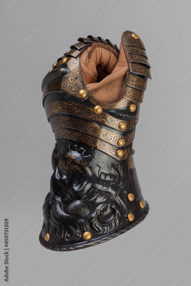 Medieval knightly brown plate gauntlet from Italian armor, in the form ...