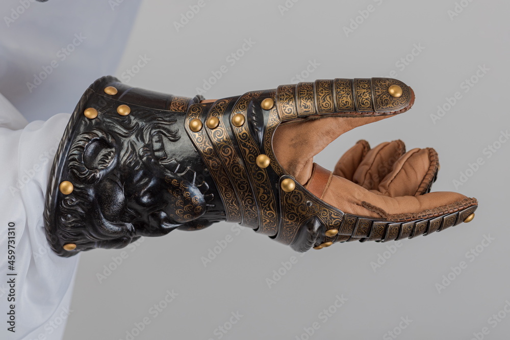 Medieval knightly brown plate gauntlet from Italian armor, in the form ...