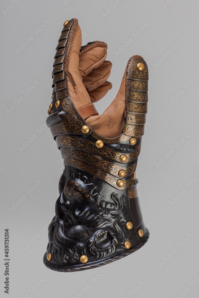 Medieval knightly brown plate gauntlet from Italian armor, in the form ...
