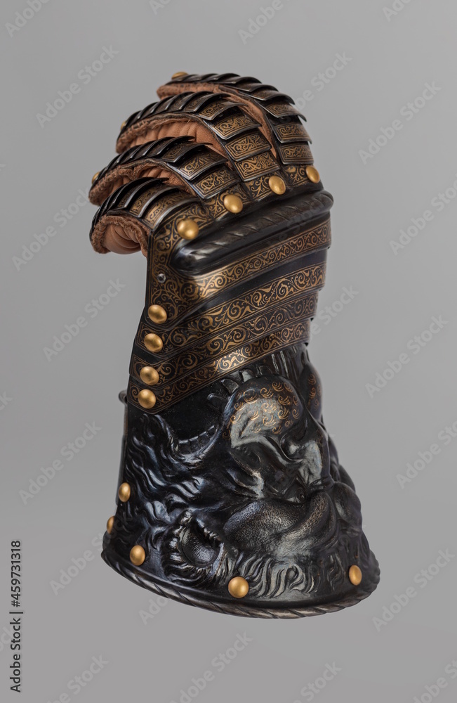 Medieval knightly brown plate gauntlet from Italian armor, in the form ...