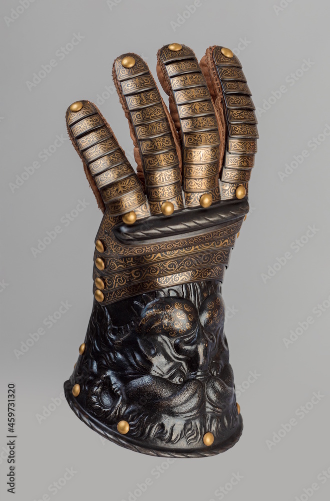 Medieval knightly brown plate gauntlet from Italian armor, in the form ...