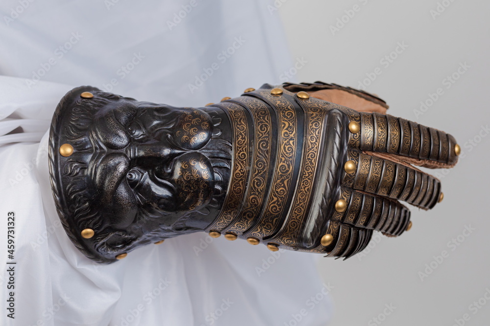 Medieval knightly brown plate gauntlet from Italian armor, in the form ...