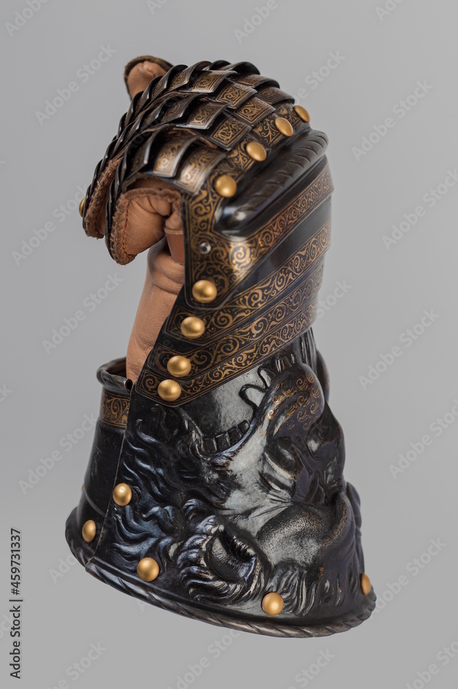 Medieval knightly brown plate gauntlet from Italian armor, in the form ...