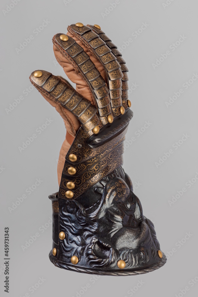 Medieval knightly brown plate gauntlet from Italian armor, in the form ...