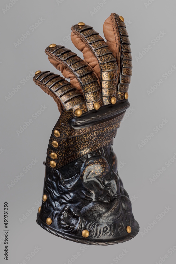 Medieval knightly brown plate gauntlet from Italian armor, in the form ...