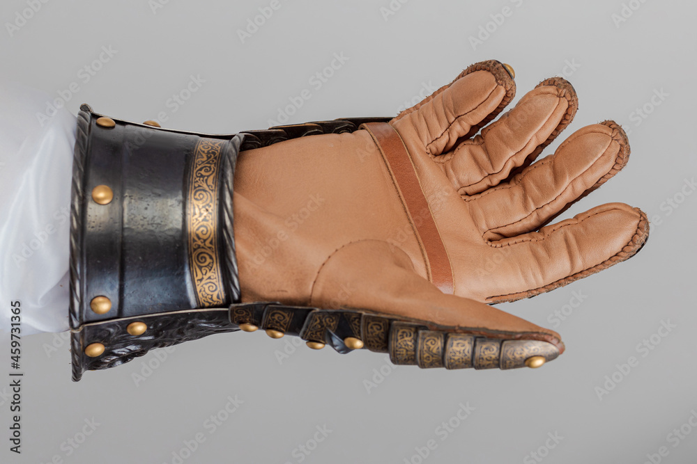 Medieval knightly brown plate gauntlet from Italian armor, in the form ...