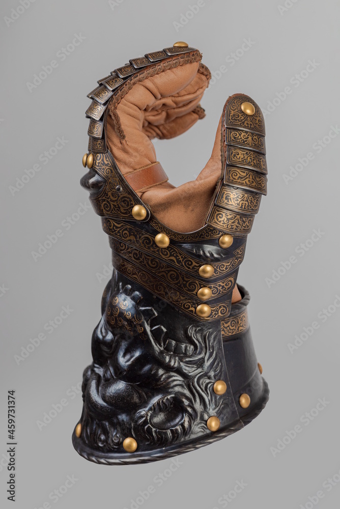 Medieval knightly brown plate gauntlet from Italian armor, in the form ...