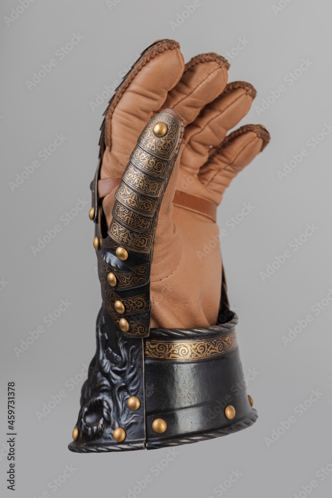 Medieval knightly brown plate gauntlet from Italian armor, in the form ...
