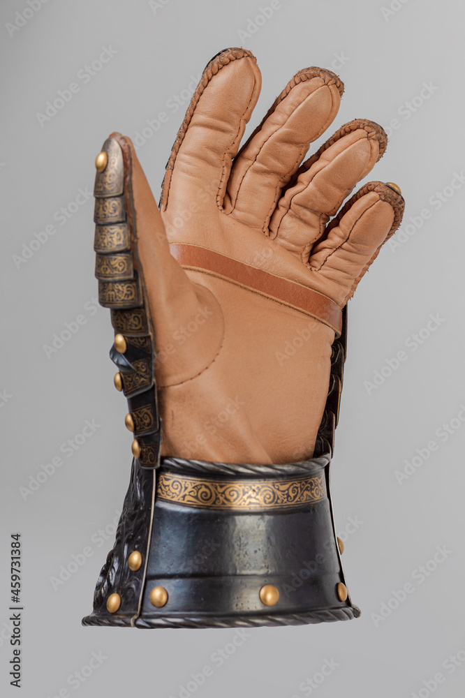 Medieval knightly brown plate gauntlet from Italian armor, in the form ...