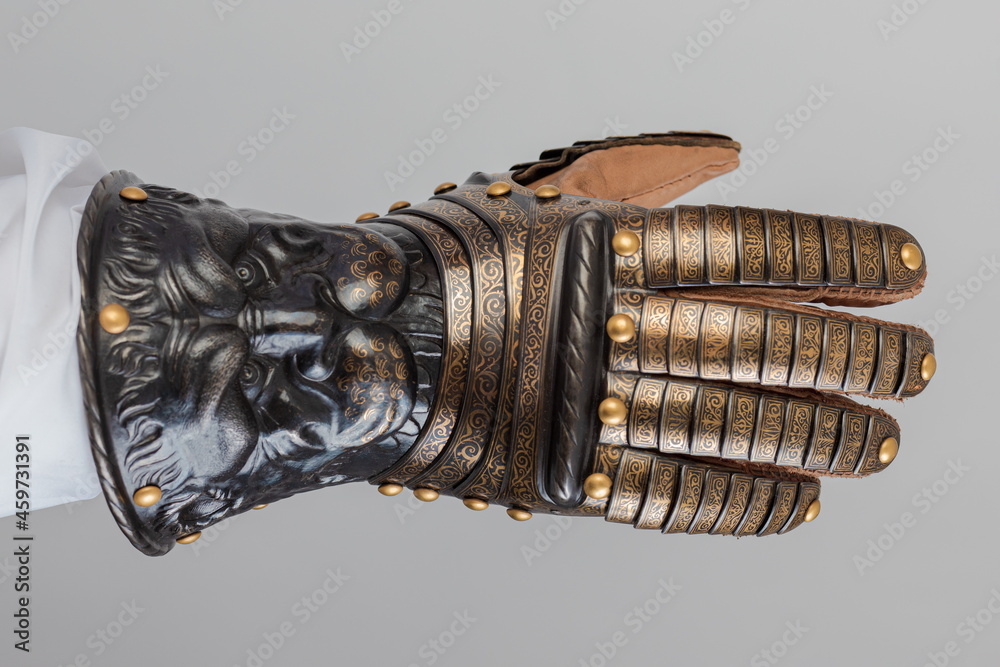Medieval knightly brown plate gauntlet from Italian armor, in the form ...