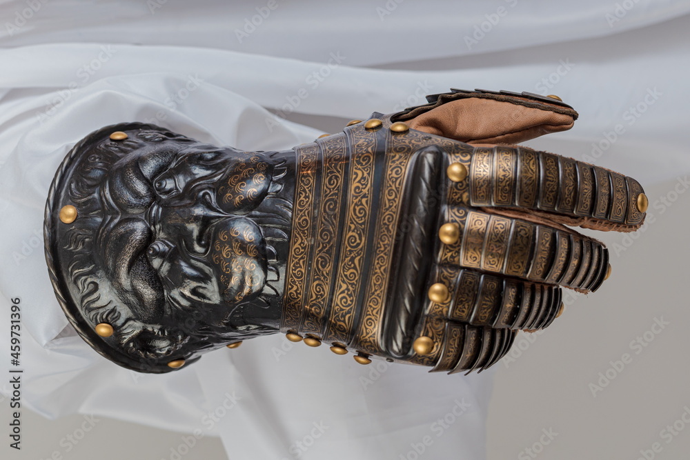 Medieval knightly brown plate gauntlet from Italian armor, in the form ...