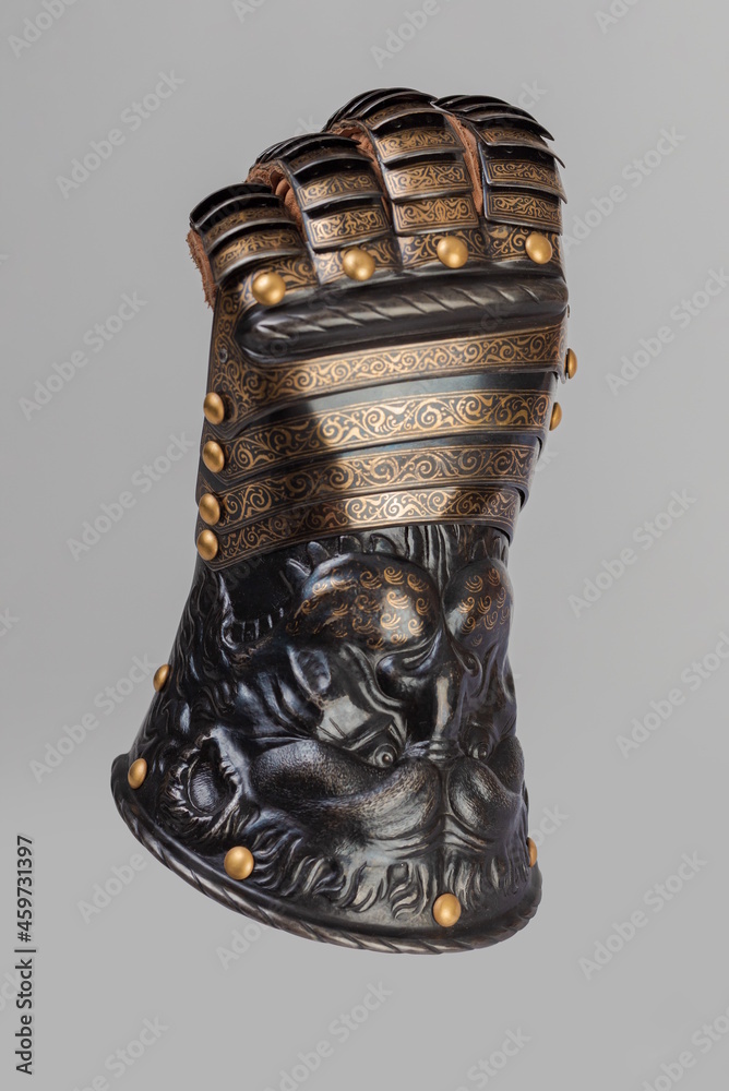 Medieval knightly brown plate gauntlet from Italian armor, in the form ...