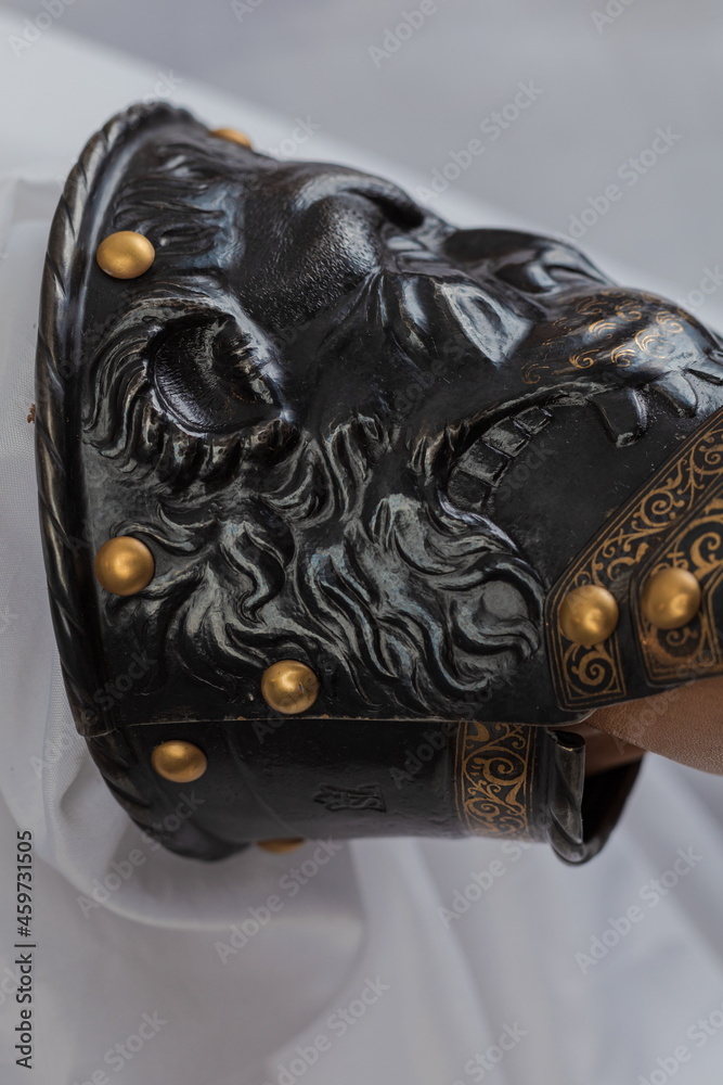 Medieval knightly brown plate gauntlet from Italian armor, in the form ...