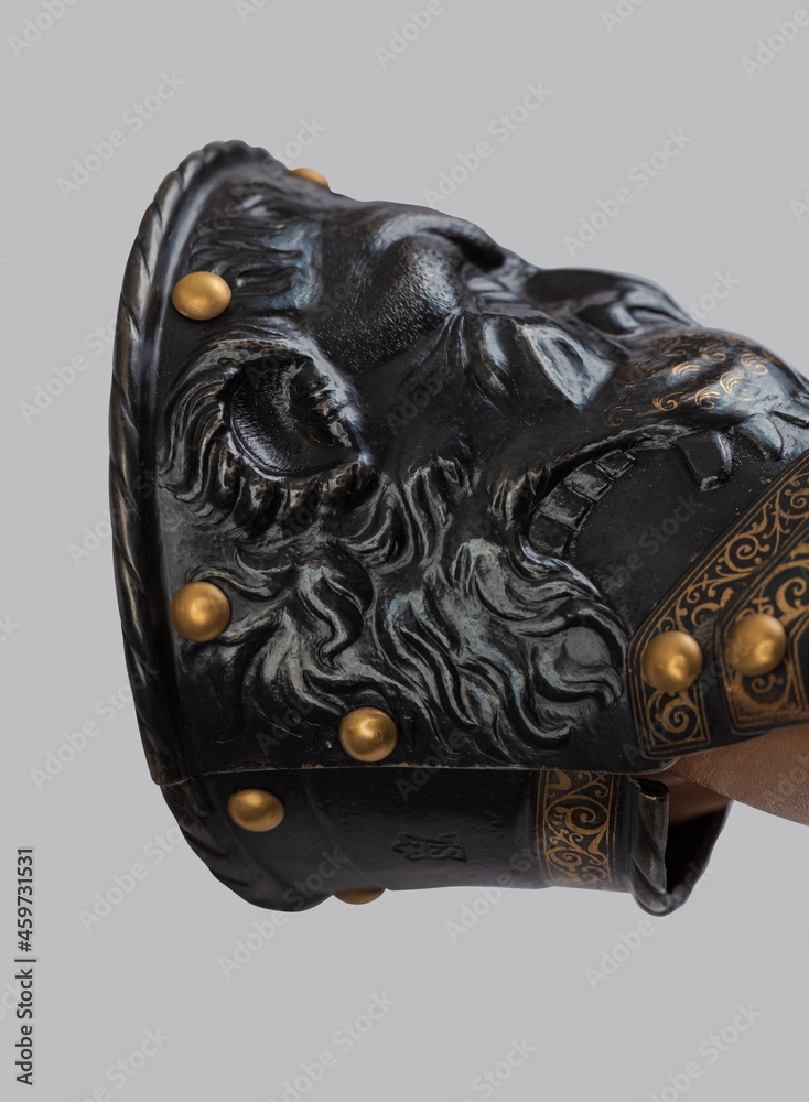 Medieval knightly brown plate gauntlet from Italian armor, in the form ...