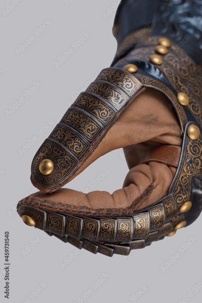 Medieval knightly brown plate gauntlet from Italian armor, in the form ...