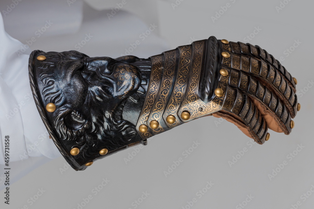 Medieval knightly brown plate gauntlet from Italian armor, in the form ...