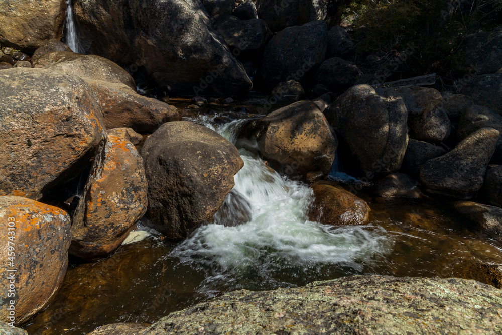 Beautiful stream rushing down a steep incline along Guanella pass road ...
