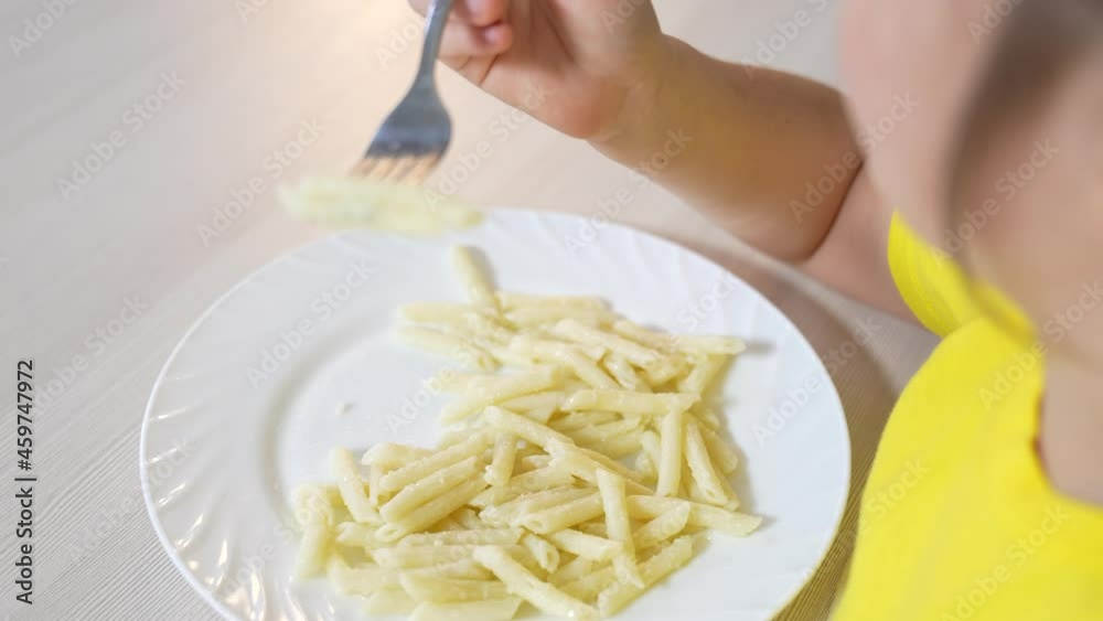 child eating pasta. healthy a food vegetarianism indoor concept. girl ...