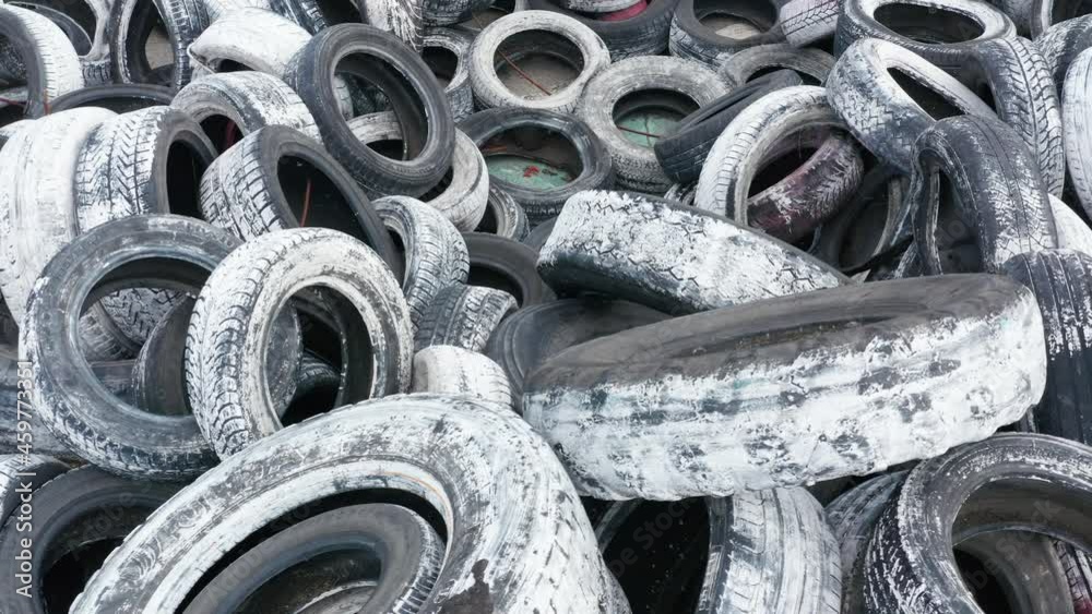 Pile of waste tires, dumped and ready for recycling. Heap of old scrap ...