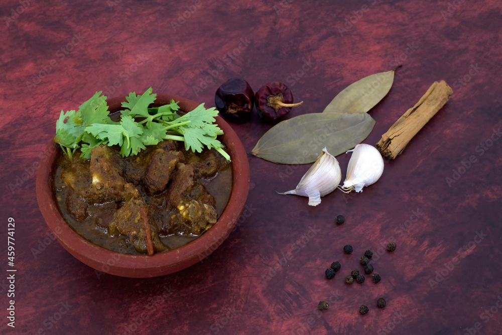 Indian cuisine, Spicy and delicious mutton curry in traditional clay ...