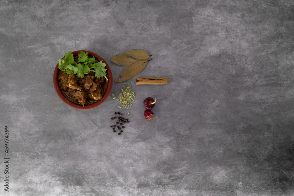 Indian cuisine, Spicy and delicious mutton curry in traditional clay ...