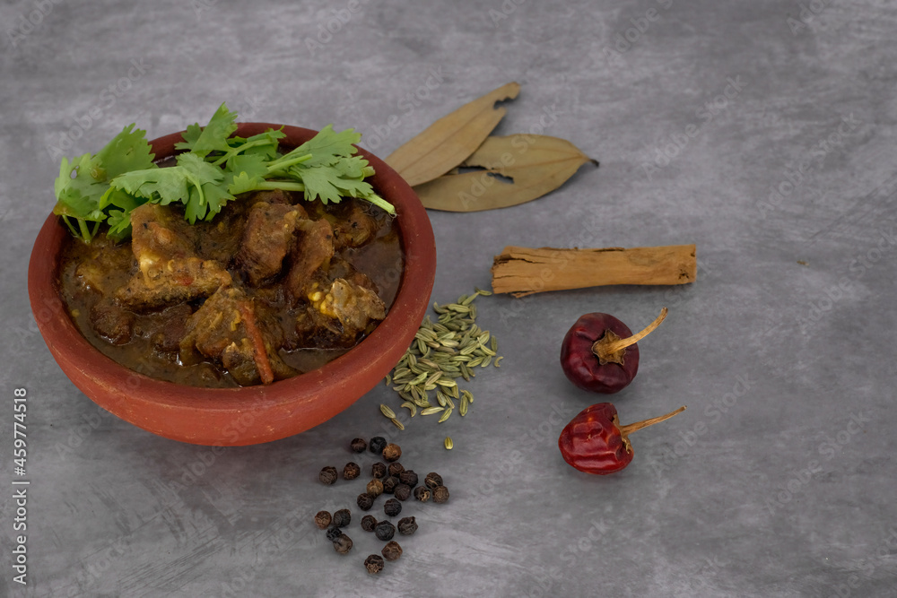 Indian cuisine, Spicy and delicious mutton curry in traditional clay ...