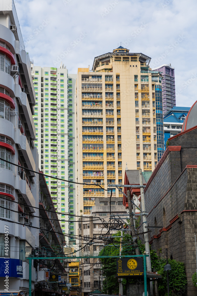 tall building seen from alleyway in manila city, the philippines Stock ...