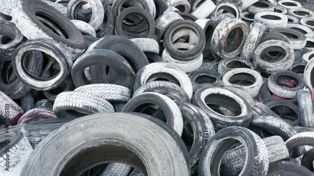 Pile of waste tires, dumped and ready for recycling. Heap of old scrap ...