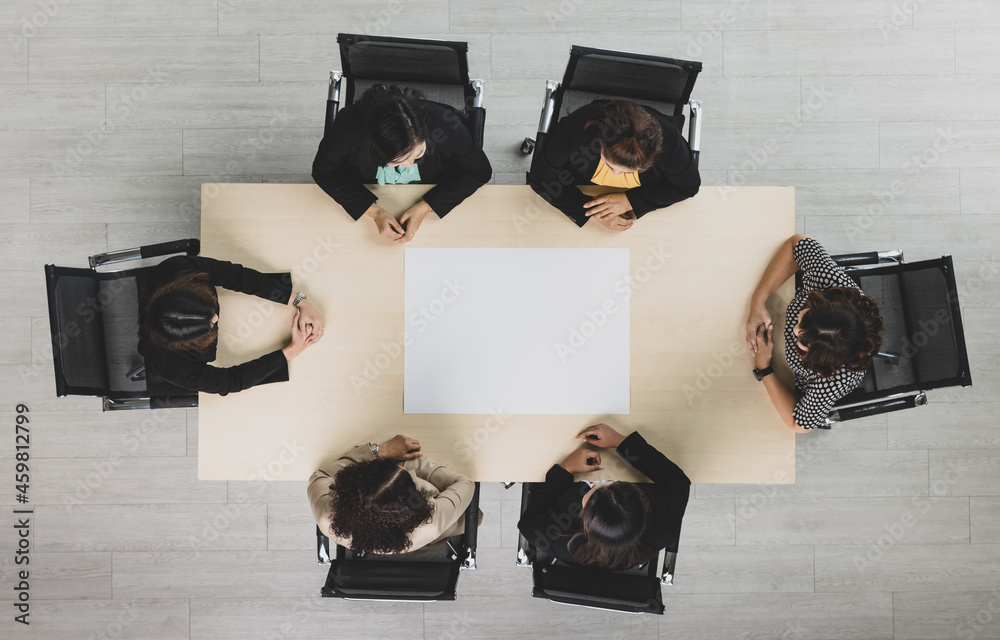 Top view of meeting conference wooden table with six executives ...