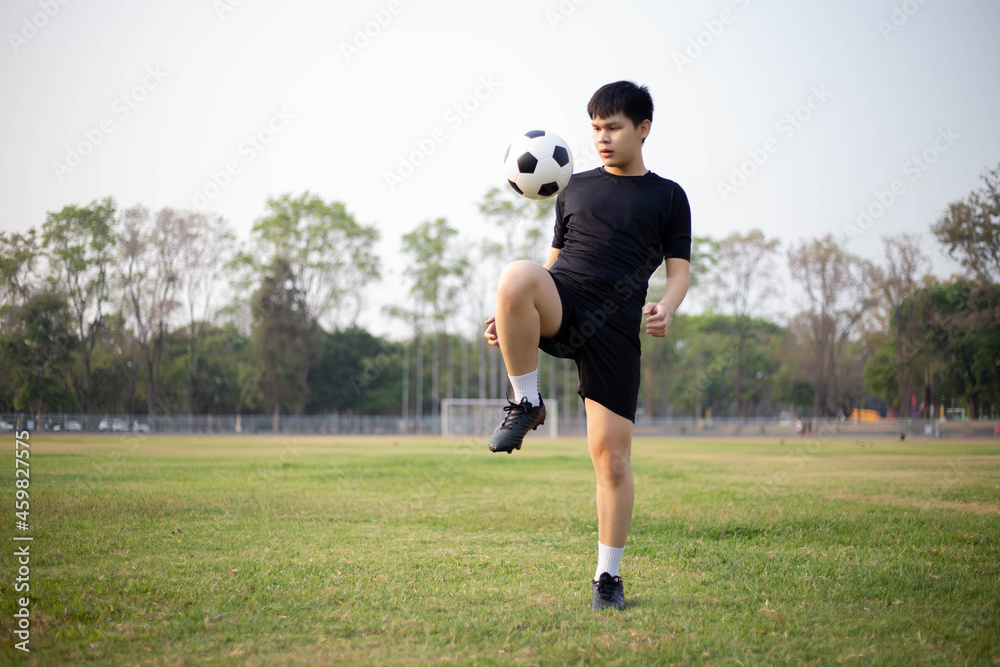 Sports and recreation concept a male soccer player wearing black t ...