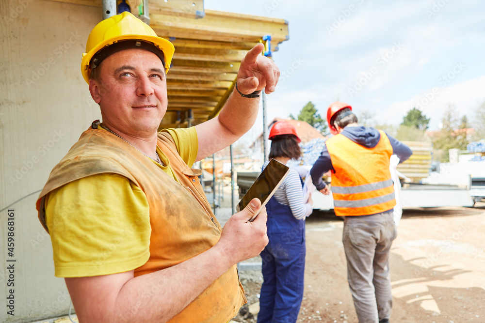 Foreman on construction site of house construction during planning ...