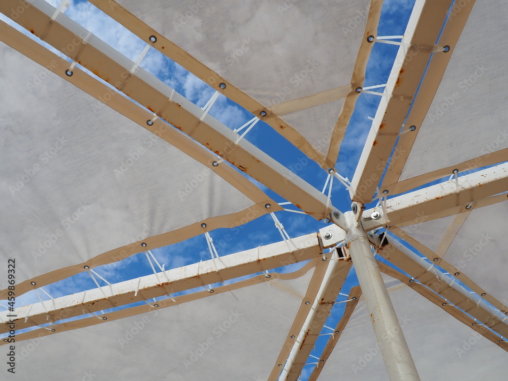 Shading canopy made of wooden beams and white fabric. Enjoy your time ...