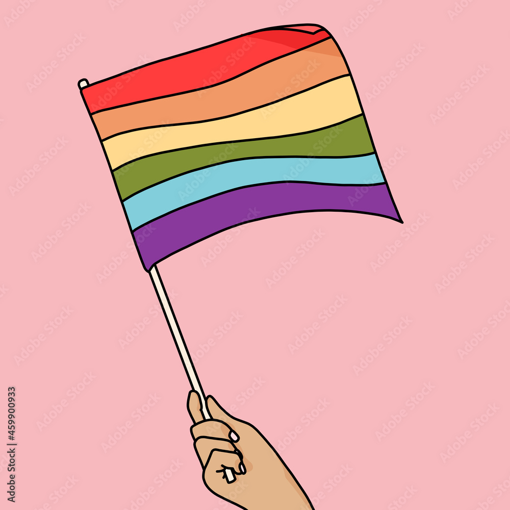 Hand holding the rainbow pride flag on pink background Stock ...