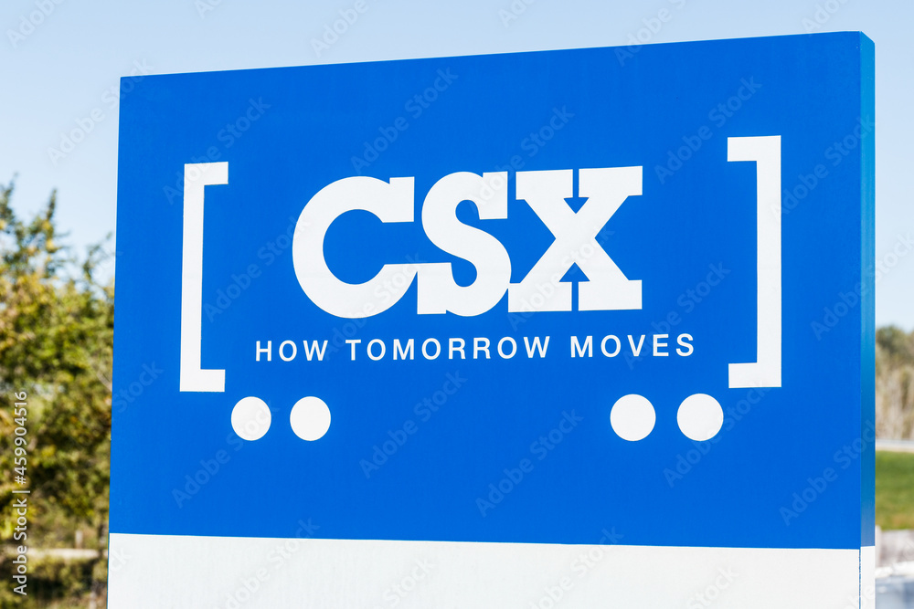 CSX Logo and signage. CSX operates a Class I train railroad in the US ...