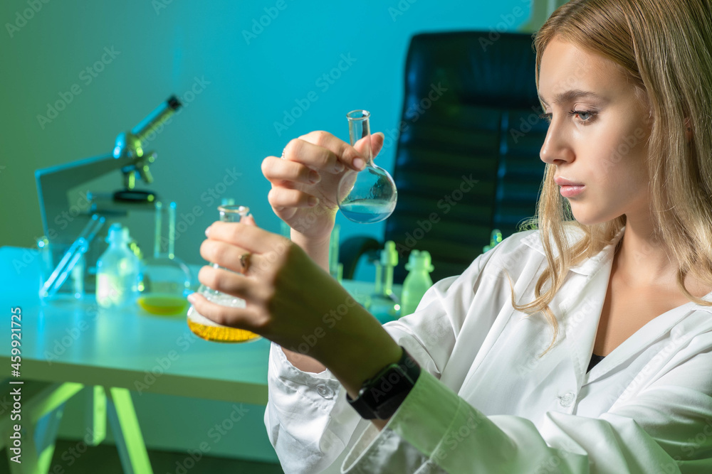 Girl in chemical laboratory. Concept - student is studying chemistry ...