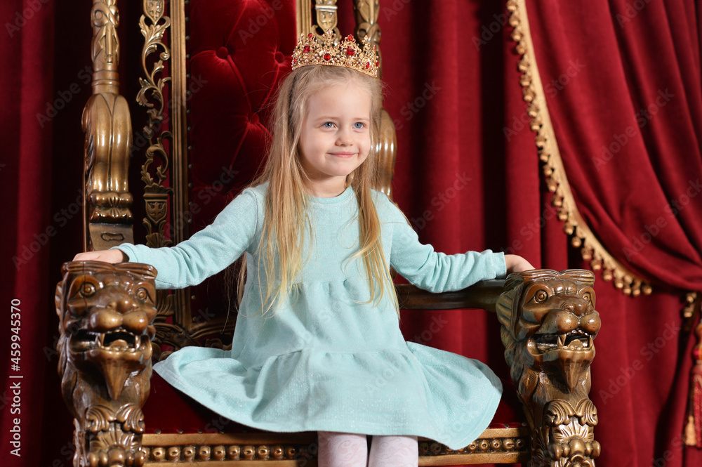 Portrait of little girl princess posing on throne Stock Photo | Adobe Stock