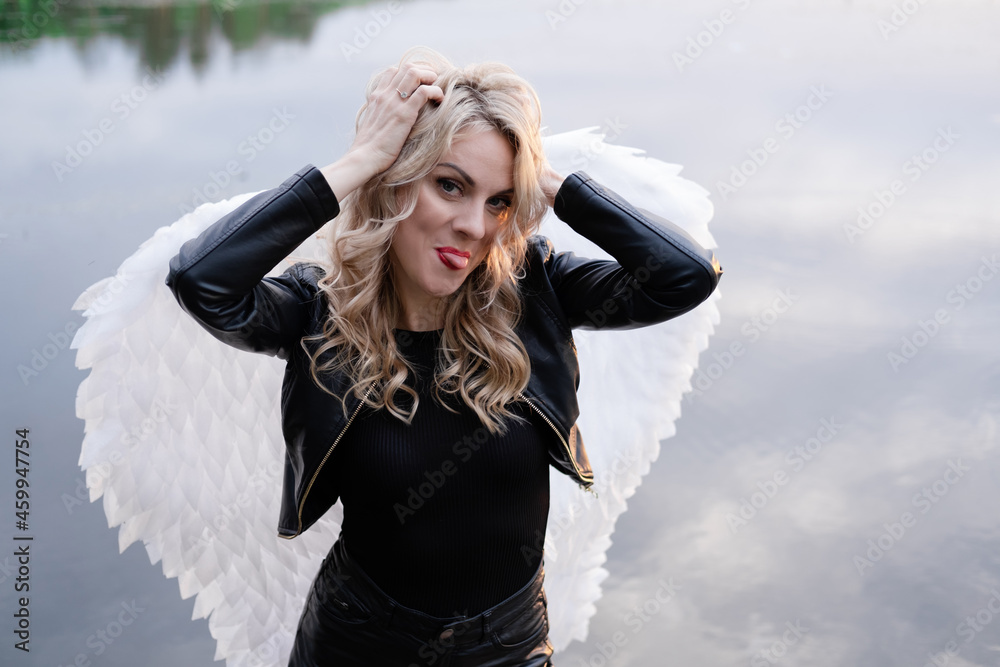 Fotografia do Stock: woman with white angel wings. wearing black ...