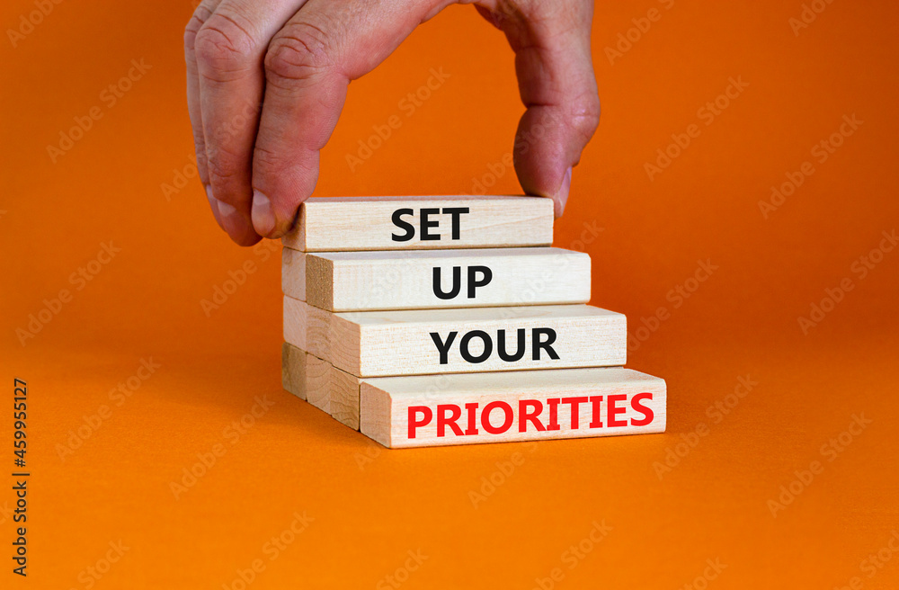 Set up your priorities symbol. Wooden bloks with words 'Set up your ...