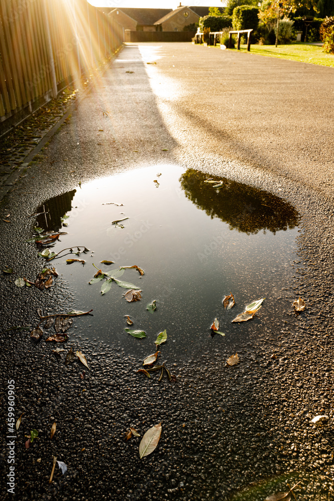 Overflowing drain soak away seen on a private road, after a heavy ...