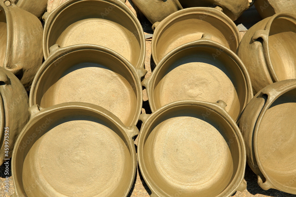 Handmade, traditional terracotta pots. Stacked look after wood fire ...