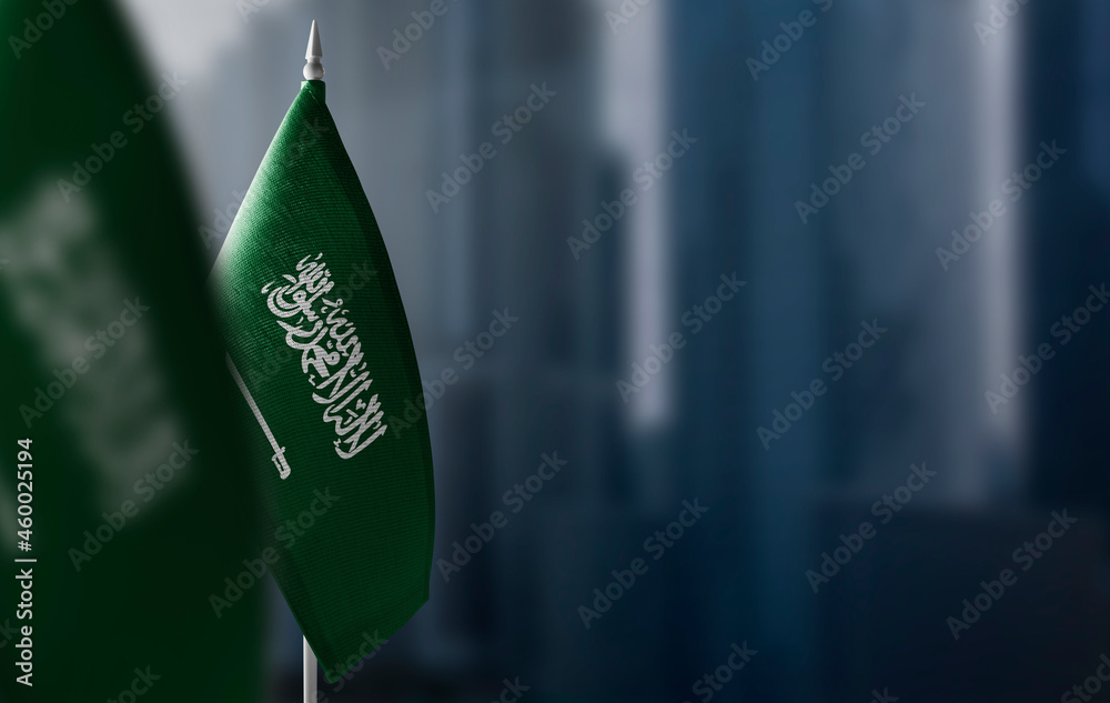 Small flags of Saudi Arabia on a blurry background of the city Stock ...